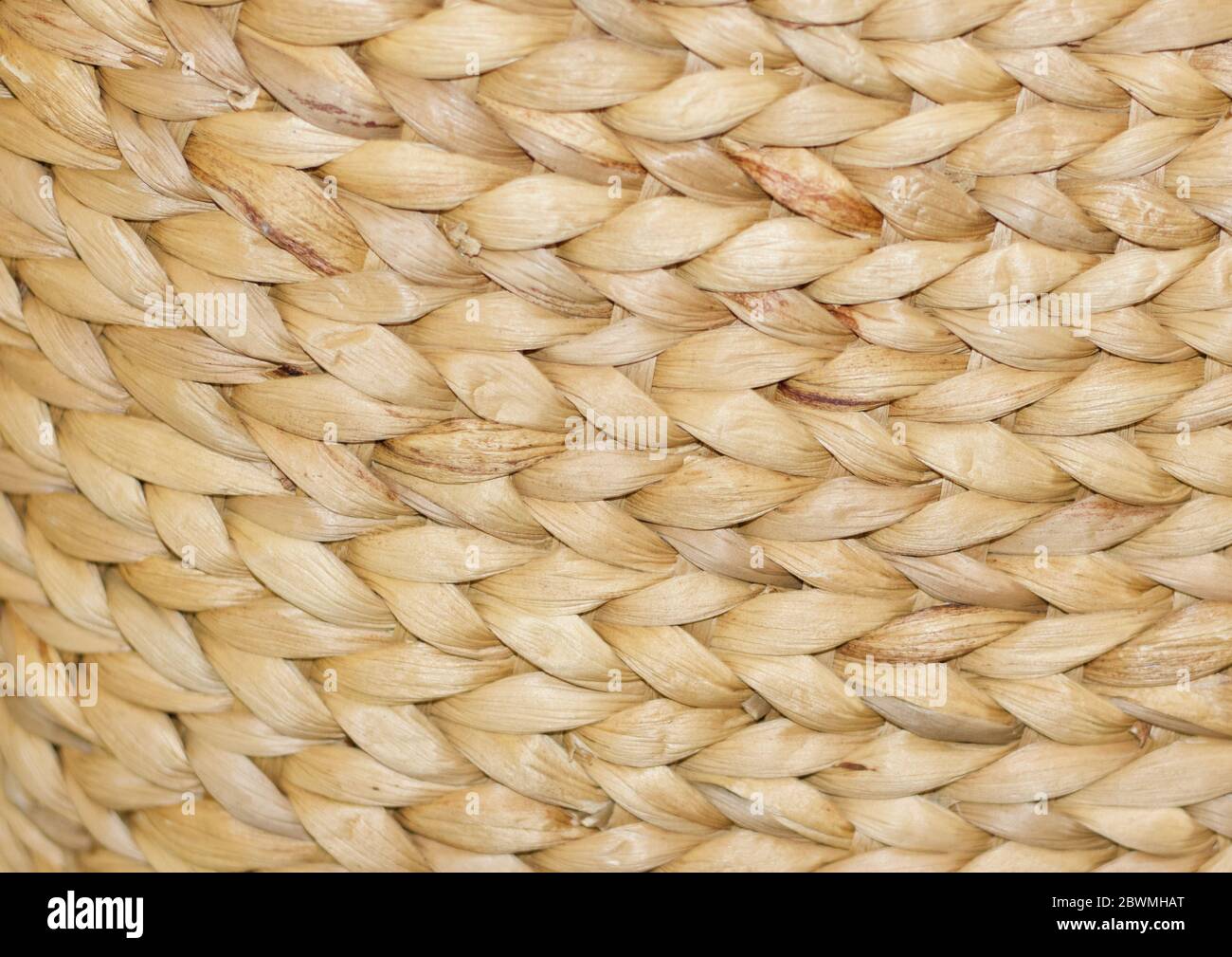Natural textured background of light coloured woven grass type material ...