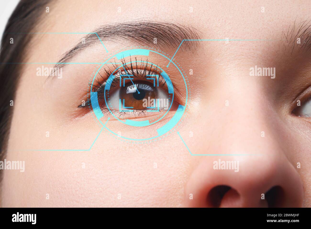 Modern cyber woman with technolgy eye looking. The young woman 's eye ...