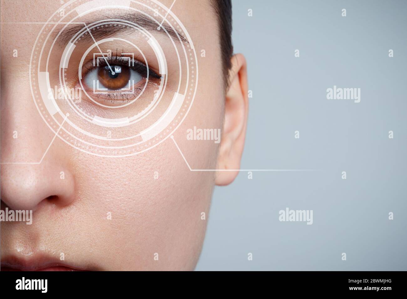 Modern cyber woman with technolgy eye looking. The young woman 's eye ...