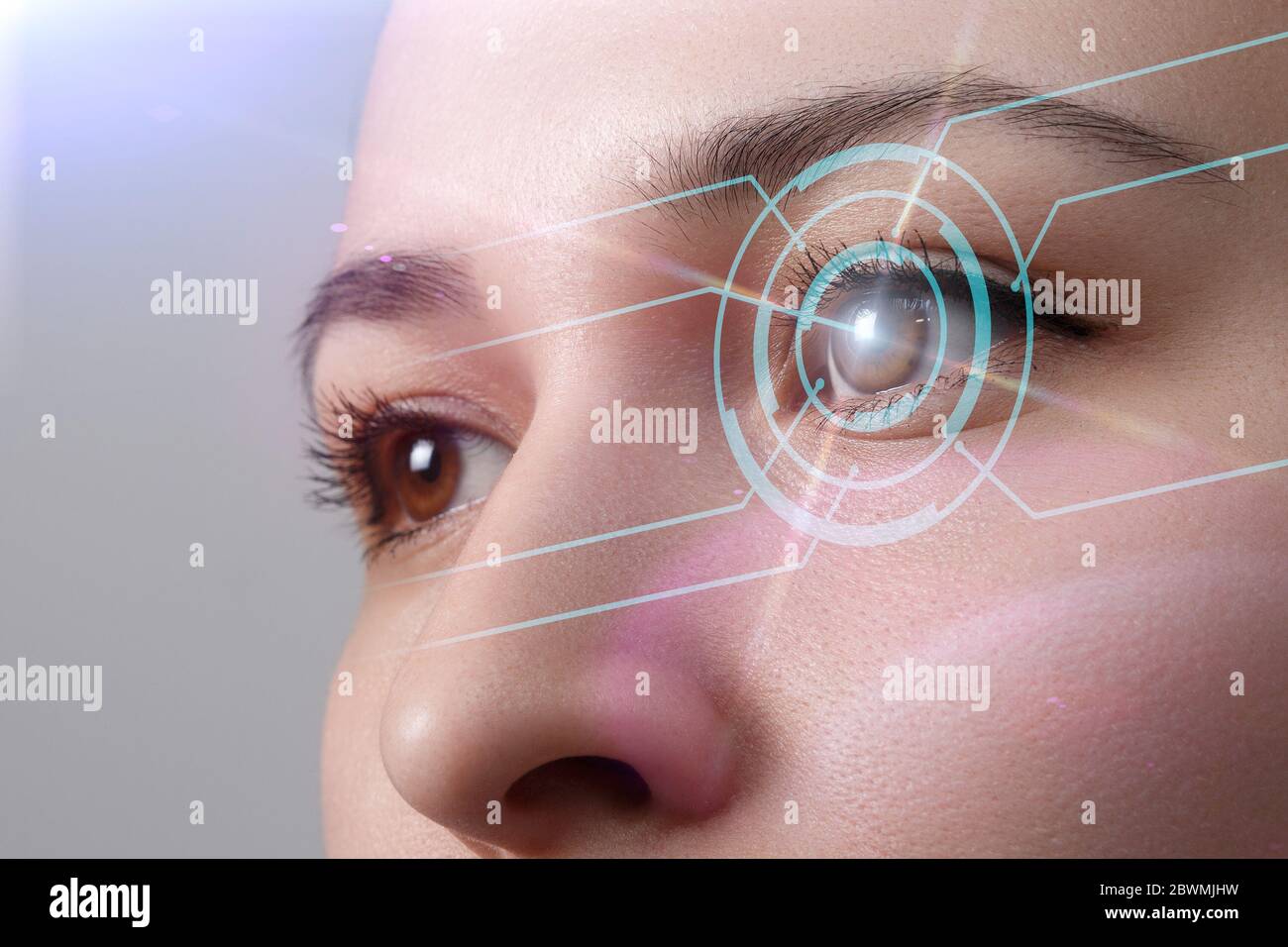 Modern cyber woman with technolgy eye looking. The young woman 's eye ...