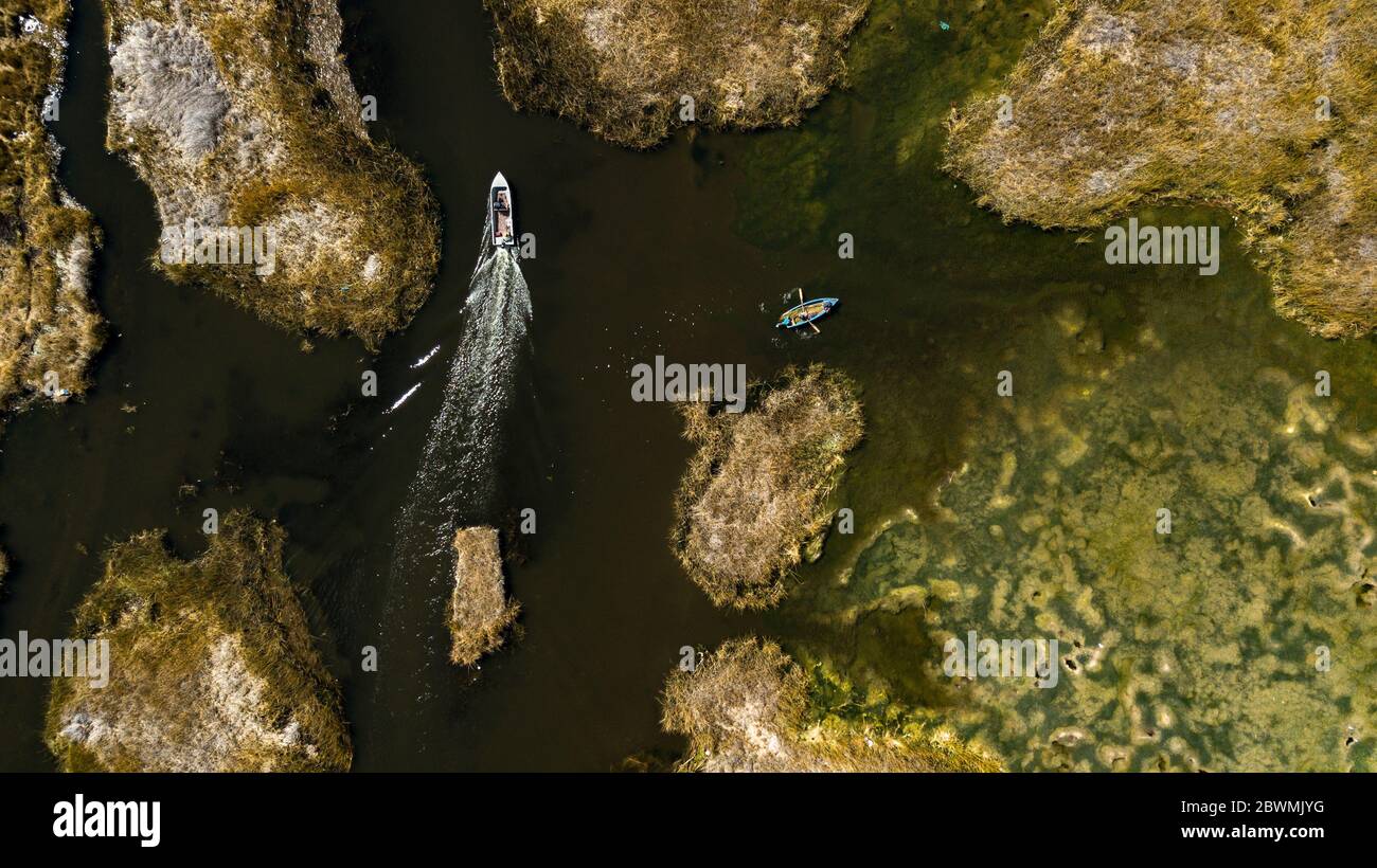 Aerial top-down view on motor speed boat rushing through pathways ...