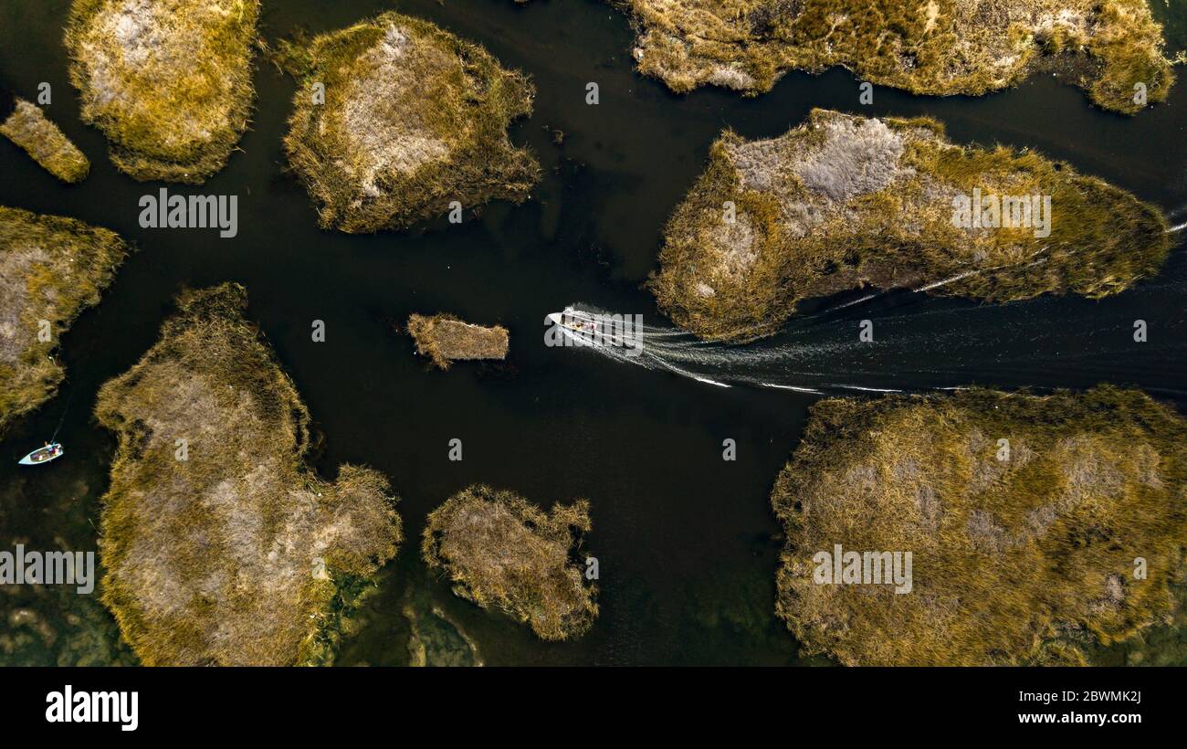 Aerial top-down view on motor speed boat rushing through pathways ...