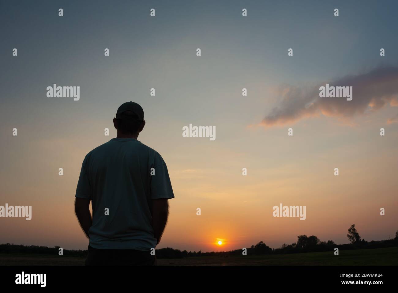 Silhouette of man looking at sunset hi-res stock photography and images ...