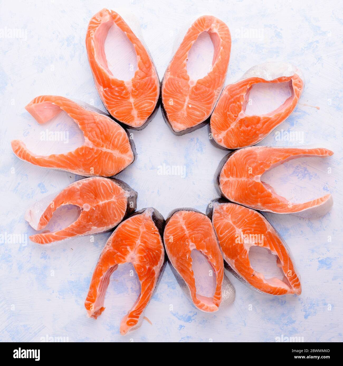 fresh uncooked red fish fillet over white Stock Photo - Alamy