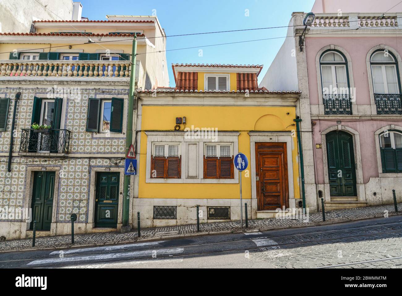 LISBON, PORTUGAL - JULY 4, 2019: Narrow cobblestone streets of the ...