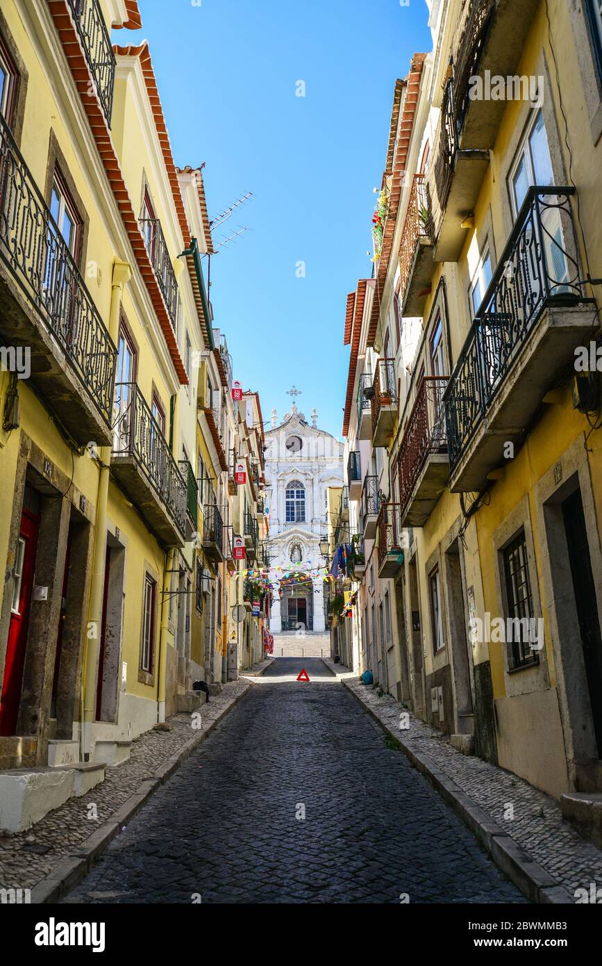 LISBON, PORTUGAL - JULY 4, 2019: Narrow cobblestone streets of the ...