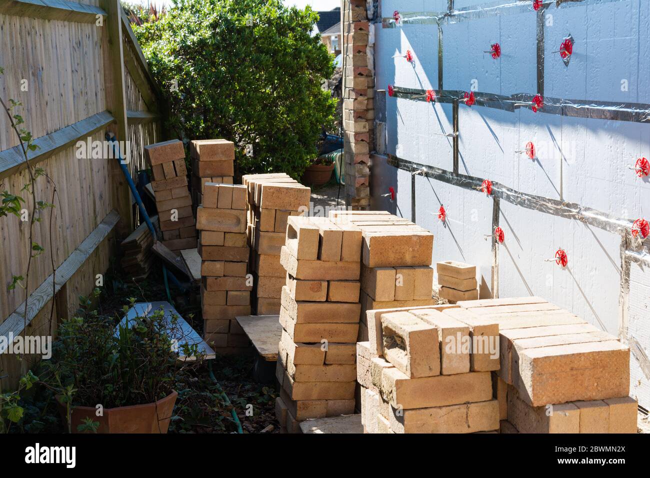 Unfinished brick wall of the hose Stock Photo - Alamy