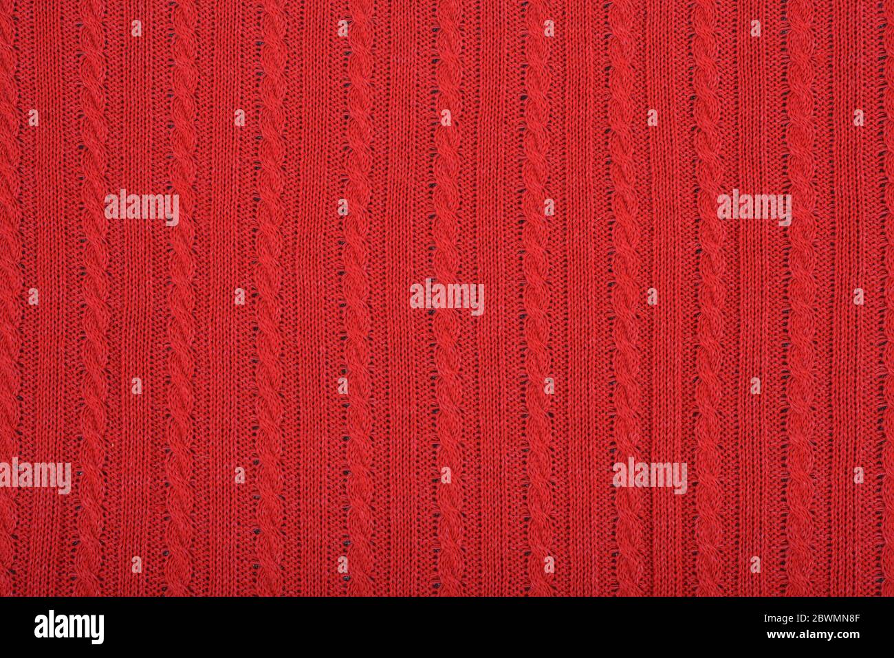 Knitted background. Knitted red texture. A knitting pattern of wool ...