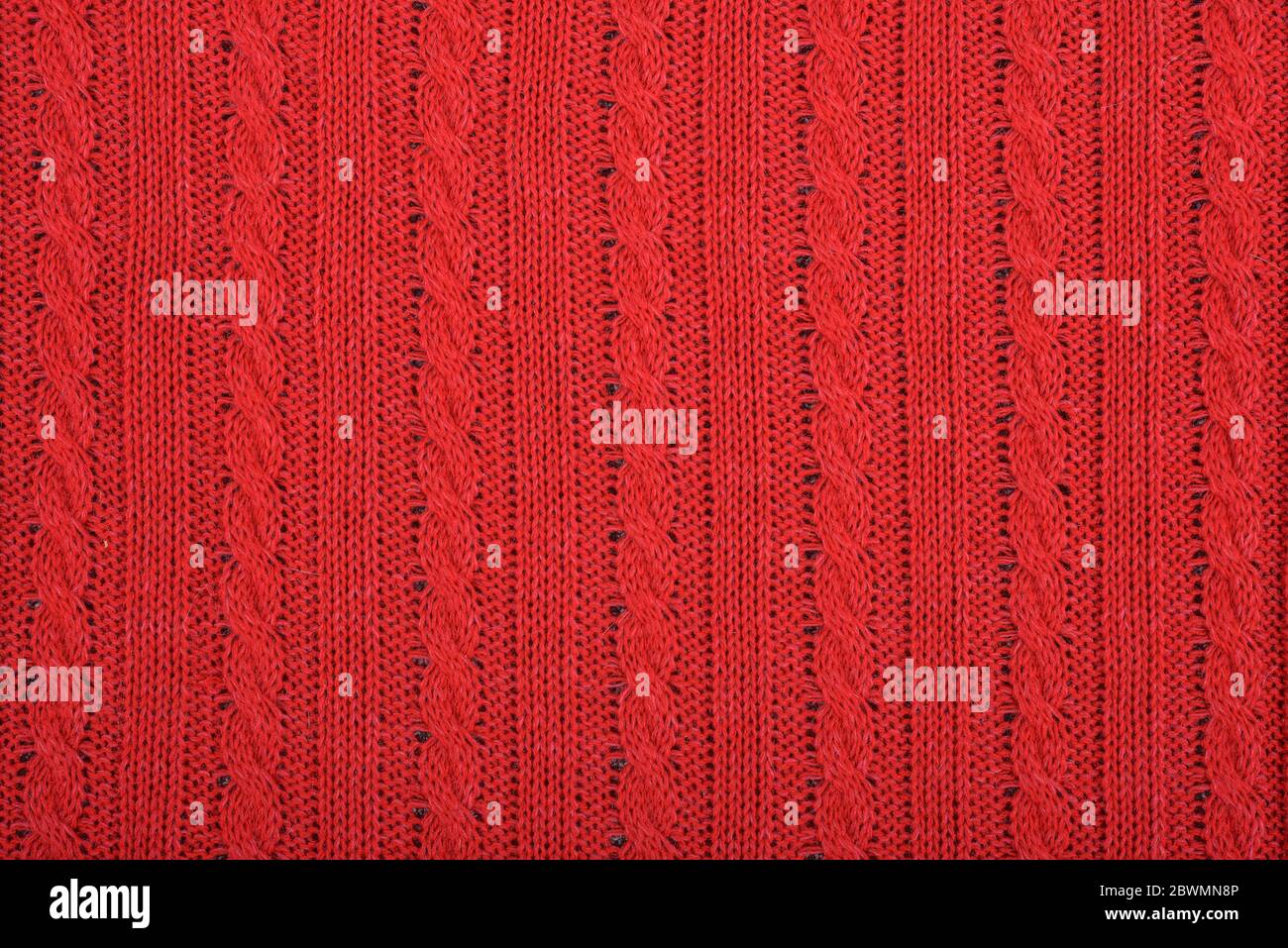 Knitted background. Knitted red texture. A knitting pattern of wool ...