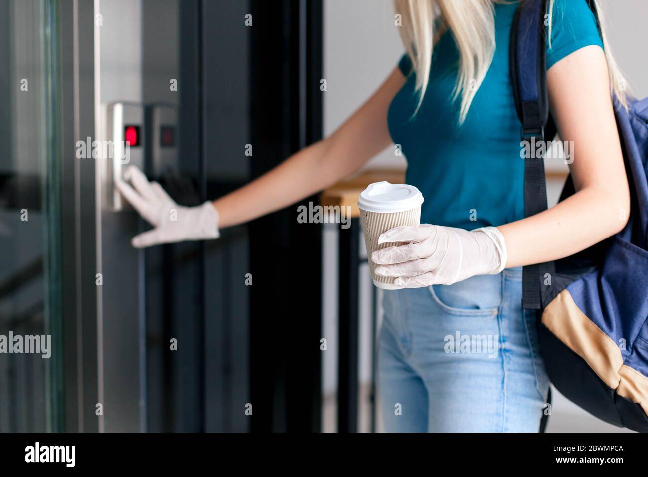 Woman Holding The Elevator Door Open High Resolution Stock Photography ...
