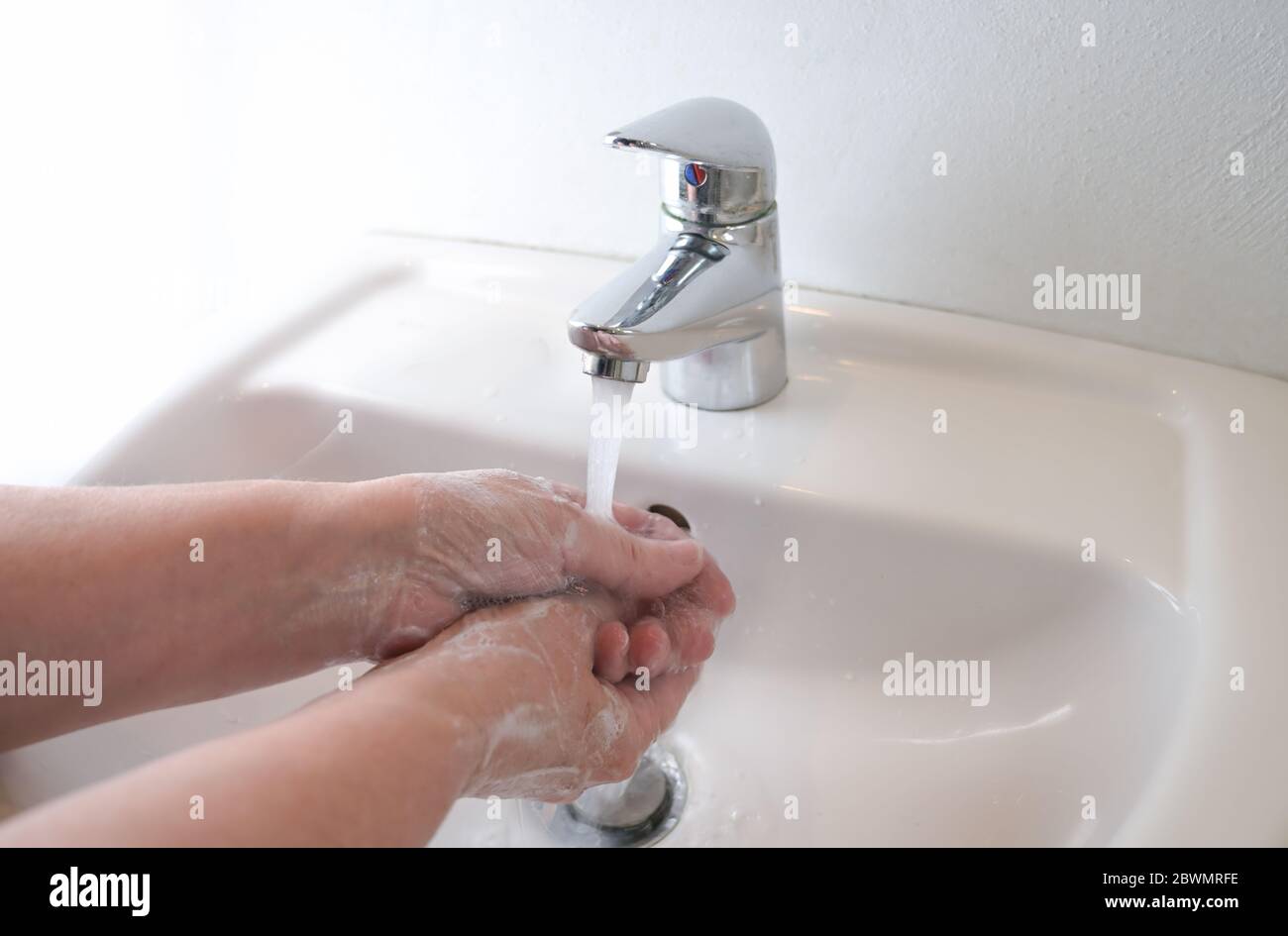 Hygiene concept, thorough hand washing with water and soap, important ...