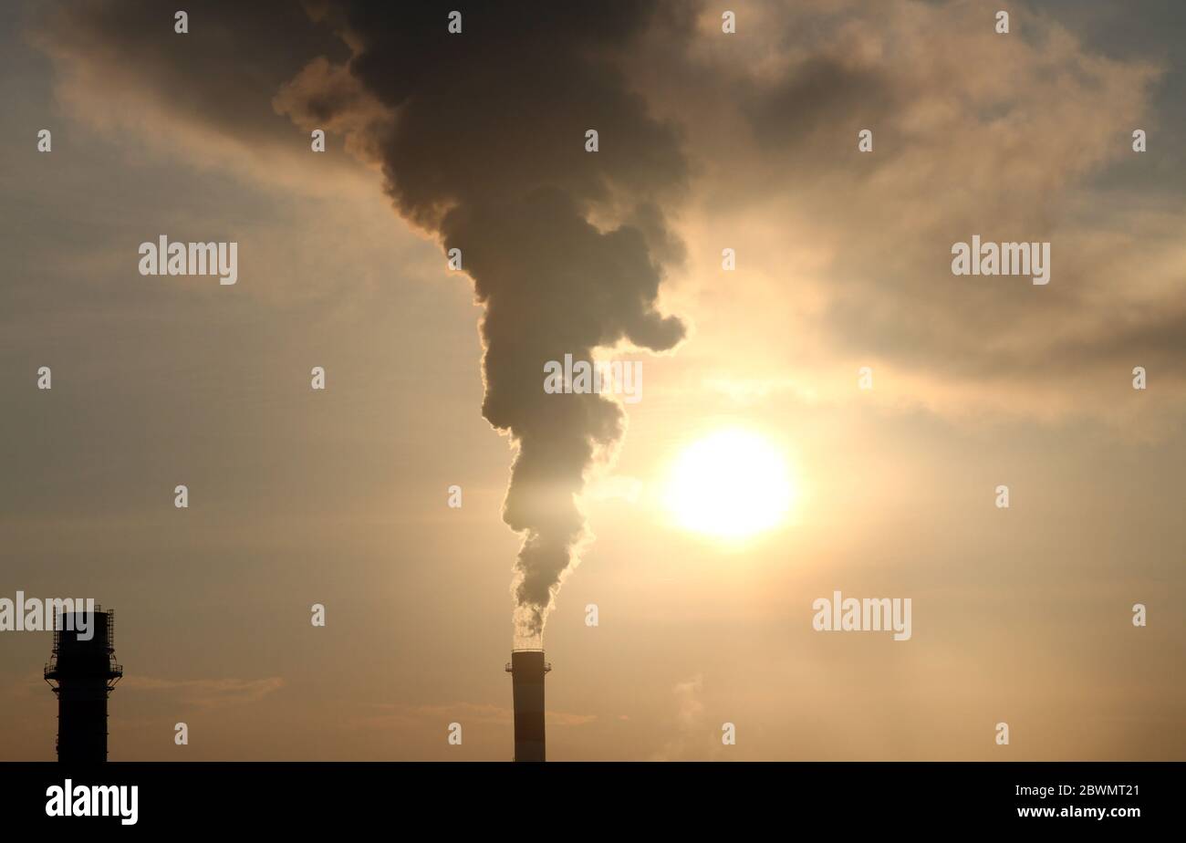 factory chimney smoke toxic on the are at sunrise sunrise Stock Photo ...