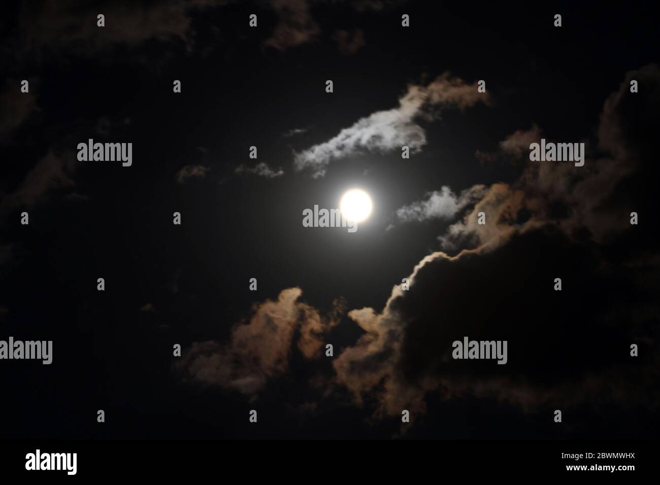 full moon light at night with clouds sky Stock Photo - Alamy