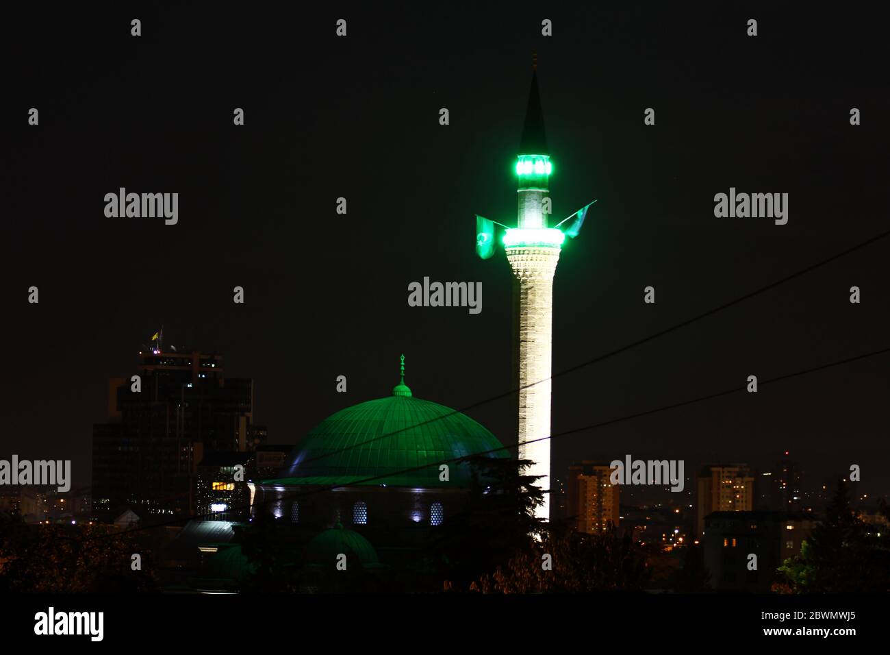 mosque at night with green light and flag Stock Photo - Alamy
