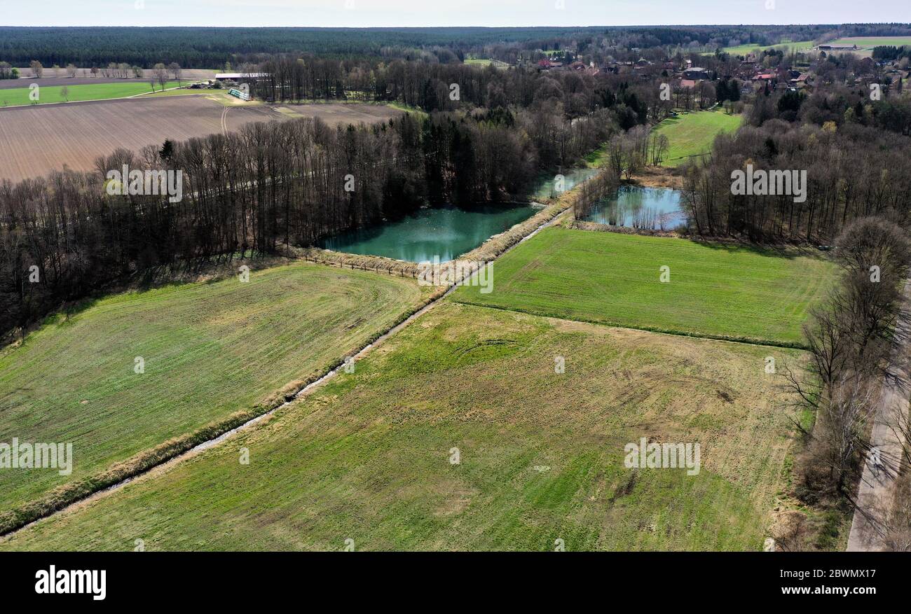 Aerial view of an agricultural meadow with two rectangular fish ponds ...