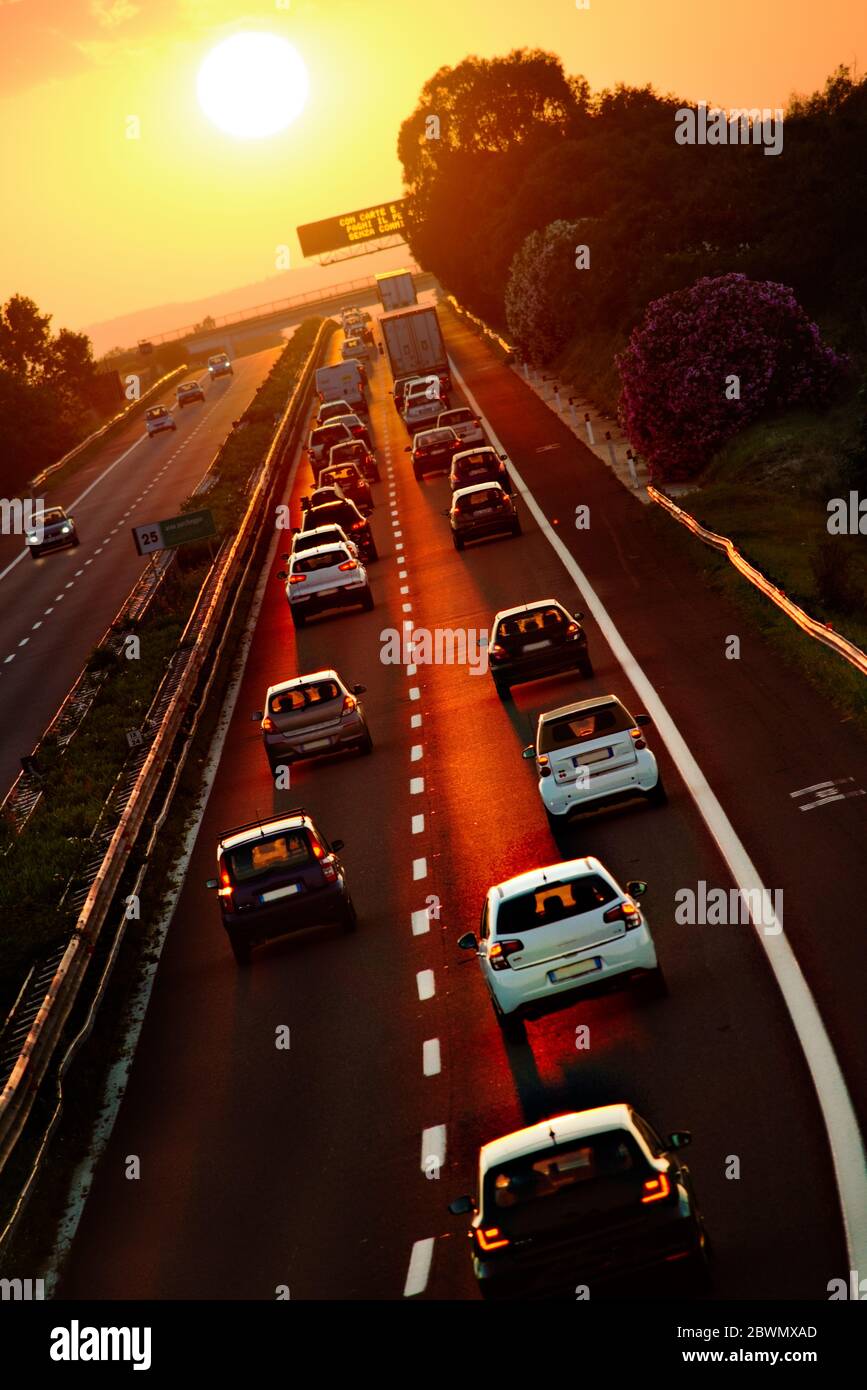 cars in the highway at sunset Stock Photo - Alamy