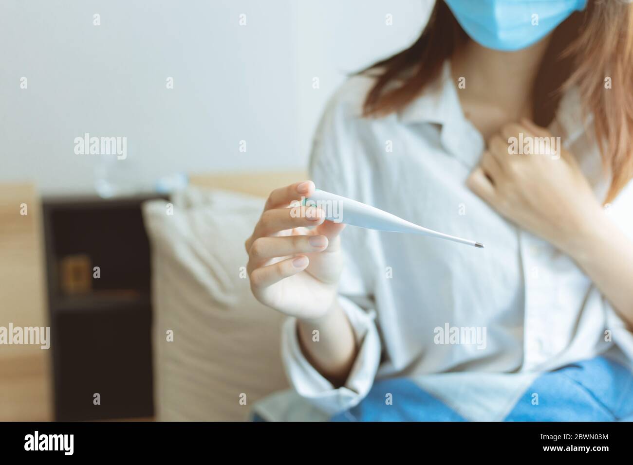 Closeup people using thermometer takes body temperature for diagnosing ...