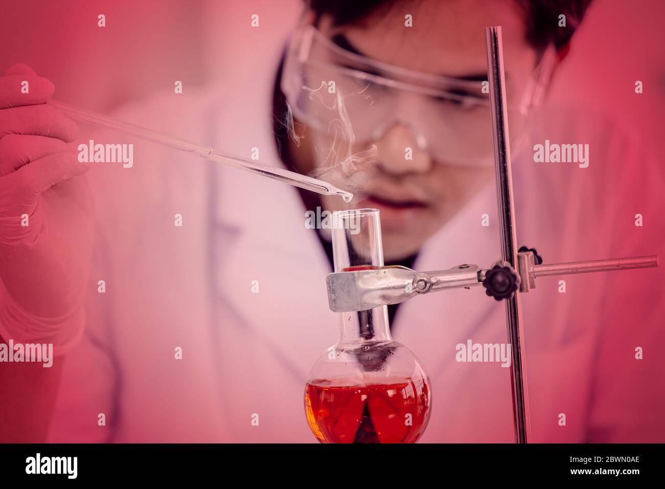 Young Asian scientist testing carefully of terrible danger and risk ...