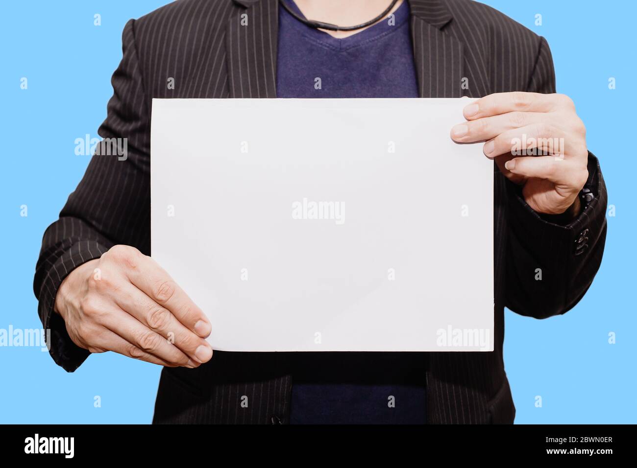 Closeup Business man hand holding show blank paper sheet mock up empty ...
