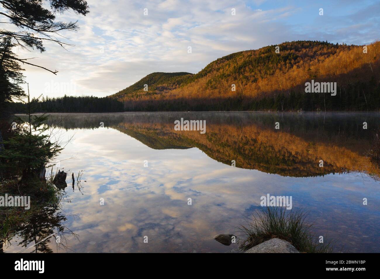 Upper Hall Pond in Sandwich, New Hampshire on a cloudy morning. This is ...