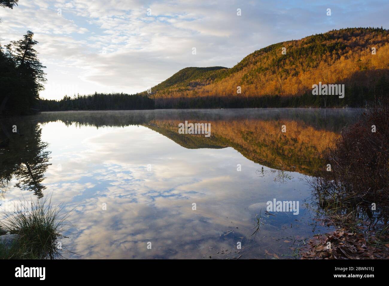 Upper Hall Pond in Sandwich, New Hampshire on a cloudy morning. This is ...
