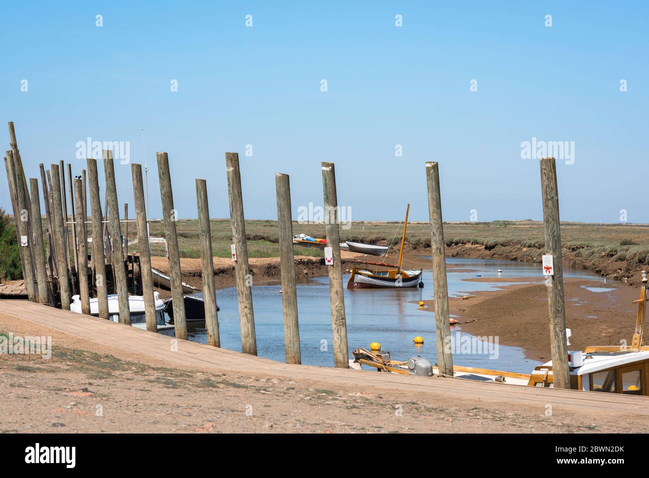 Norfolk landscape, view from Blakeney quay of boats moored on a creek ...