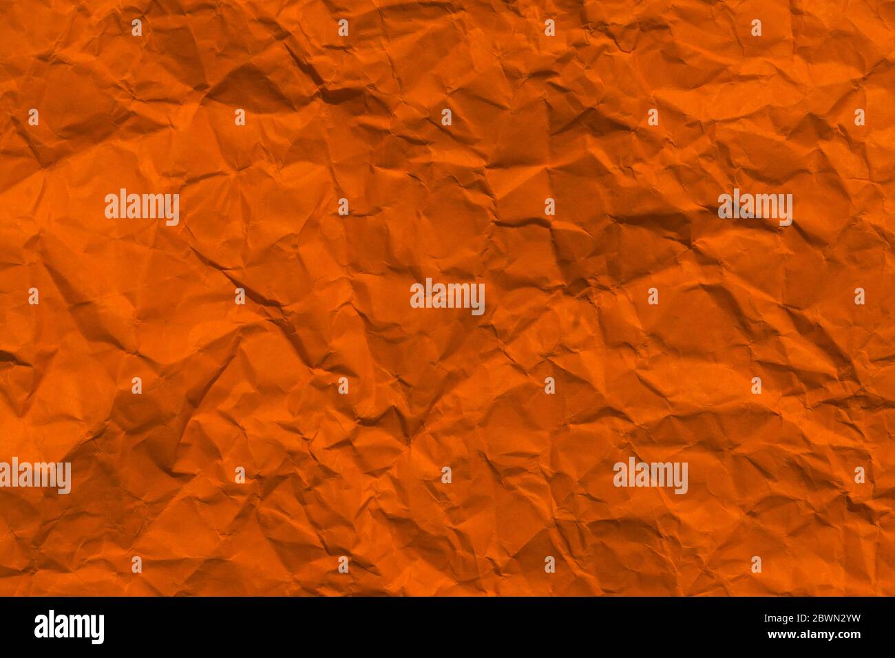 Sheet of orange crumpled paper useful as a background. Paper surface ...