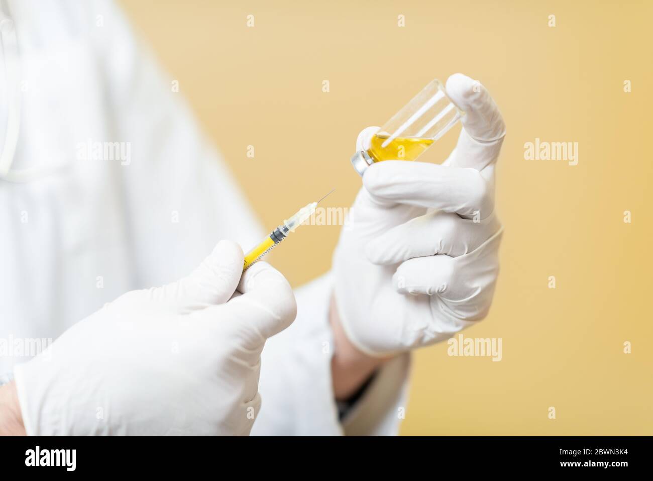 Doctor picking up holding covid hi-res stock photography and images - Alamy