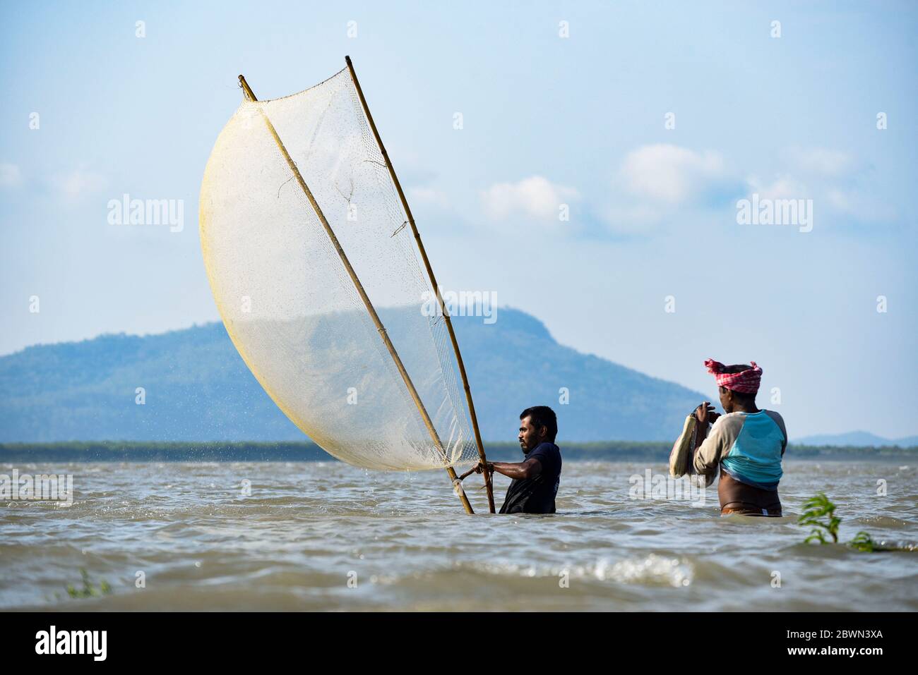 Fisherman fishing in the Brahmaputra river Stock Photo - Alamy