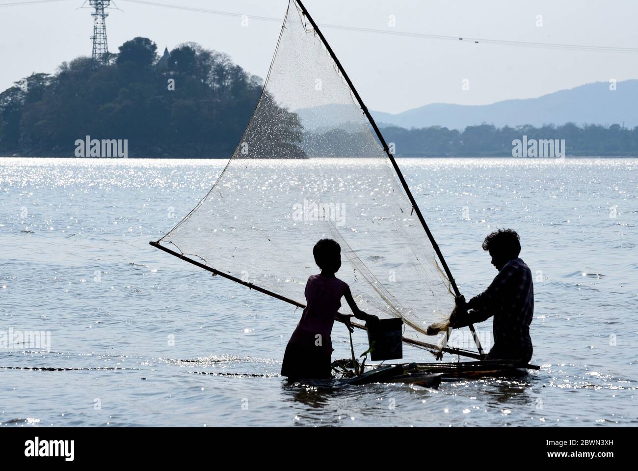 Fisherman fishing in the Brahmaputra river Stock Photo - Alamy
