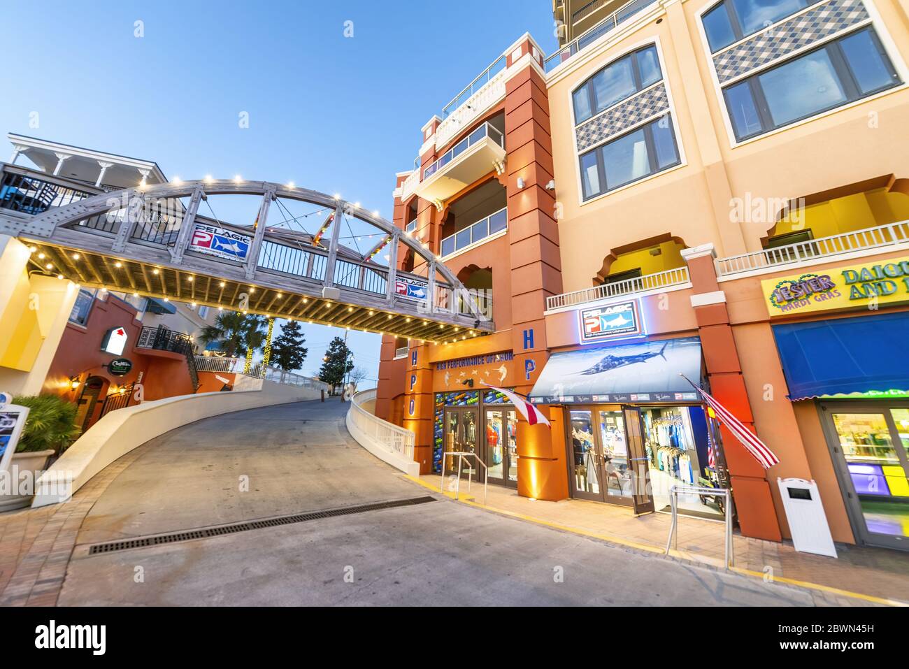 DESTIN, FLORIDA - FEBRUARY 2016: Destin Harbor Boardwalk at sunset with ...