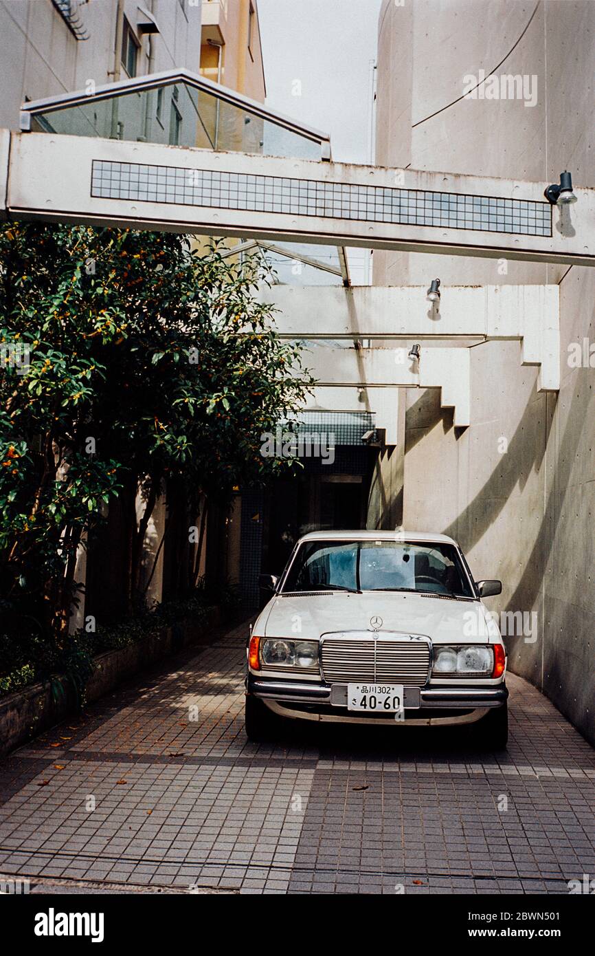 Parked car in driveway at Japanese House Stock Photo - Alamy
