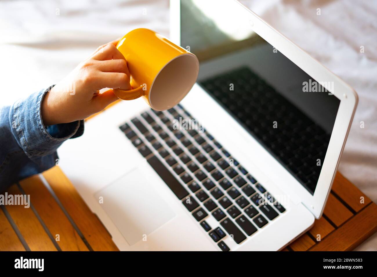 Throwing liquid into the laptop. Liquid and computer concept Stock ...