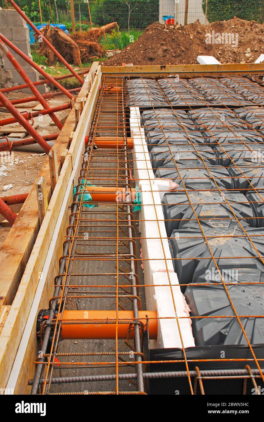Foundation works surrounded by wooden shuttering showing steel ...
