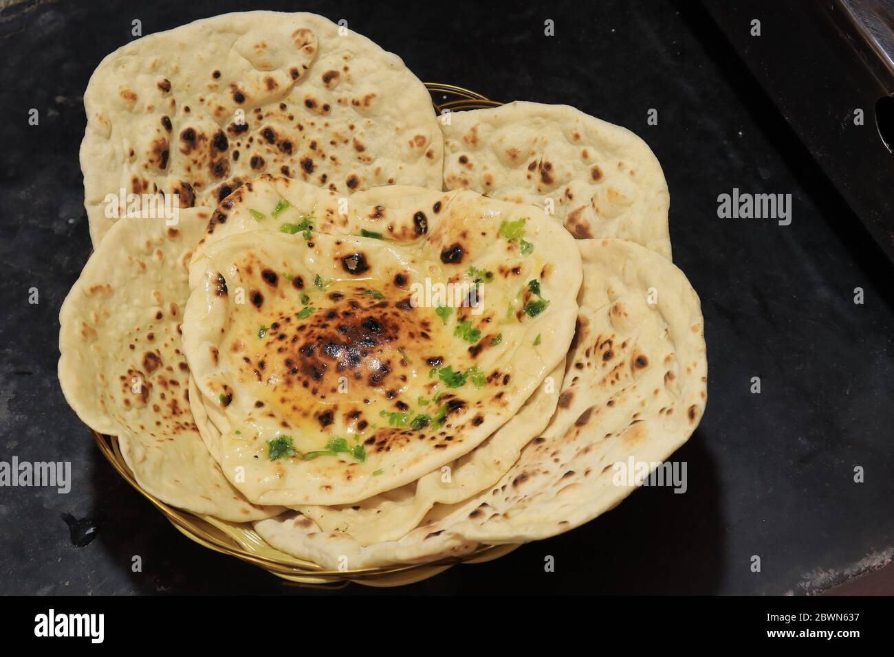 Homemade Butter Naan isolated on black background Stock Photo - Alamy