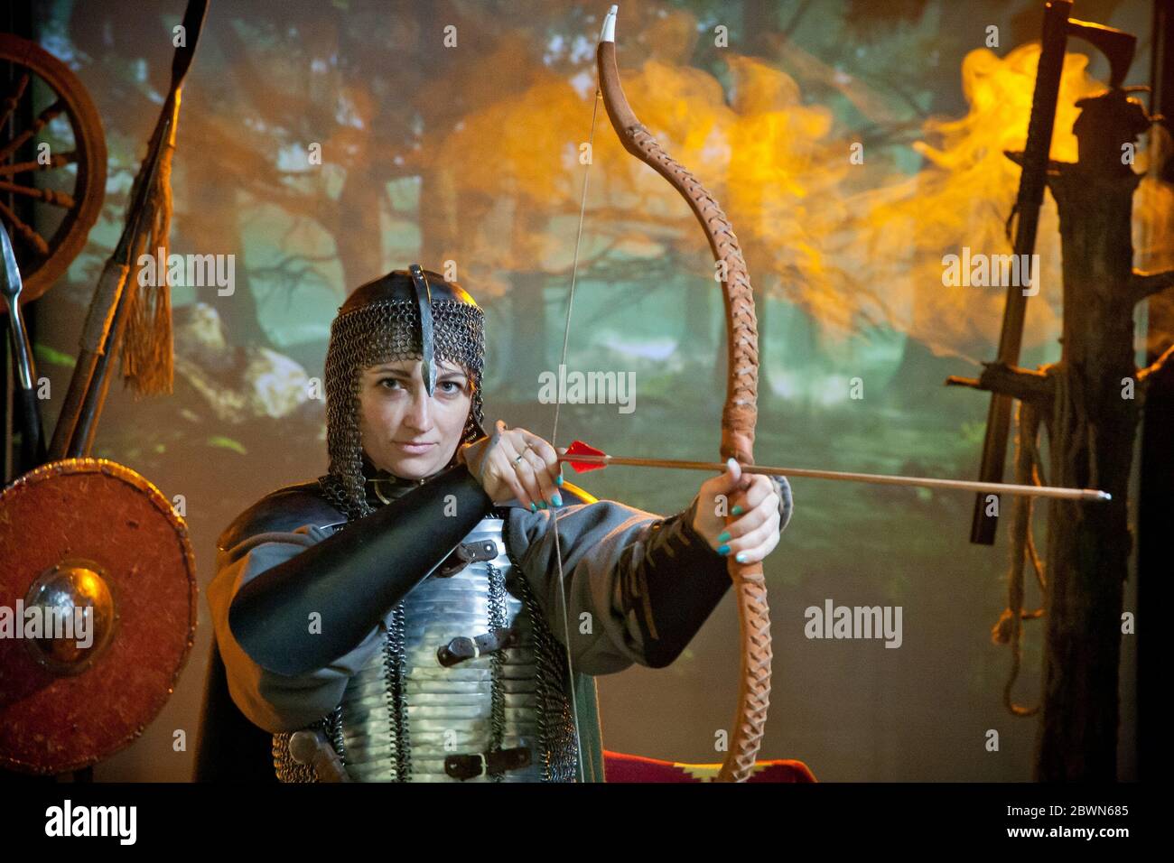 A woman in the costume of a warrior of the times of Kiev Rus in chain ...