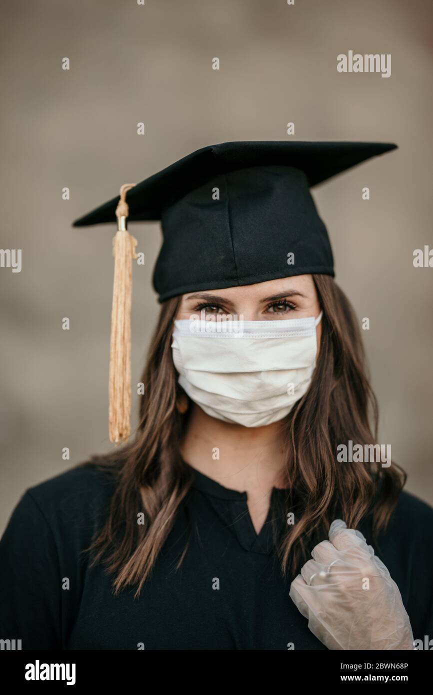 Girl graduate in graduation cap and covid 19 mask Stock Photo - Alamy