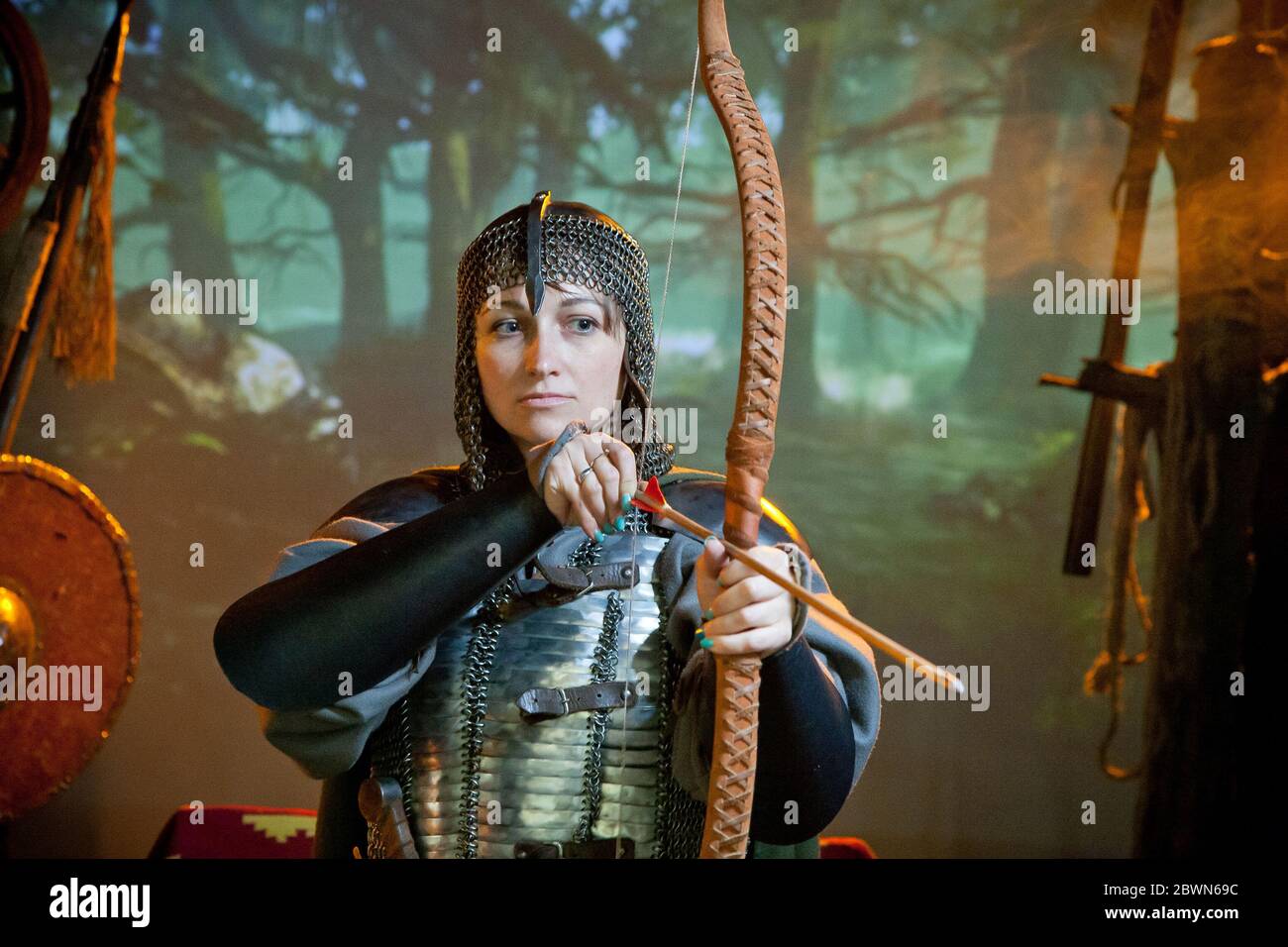 A woman in the costume of a warrior of the times of Kiev Rus in chain ...