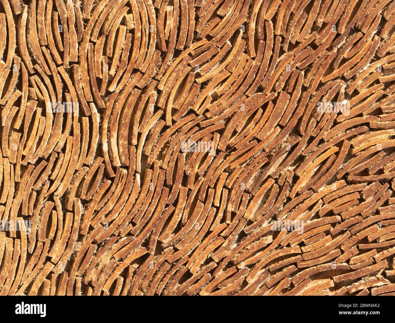 Wall panel made from a small pieces of coconut shell Stock Photo - Alamy