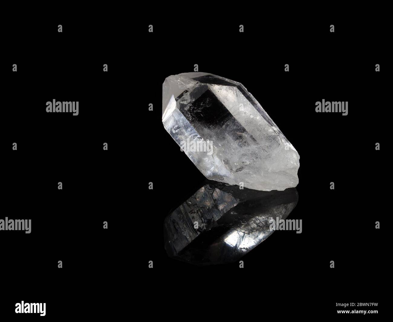 Quartz crystal, isolated on black background Stock Photo - Alamy