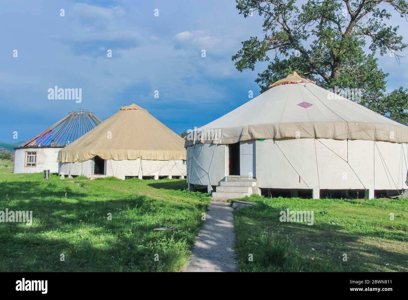 A row of traditional constructed yurts in Kalajun Grassland, Xinjiang ...