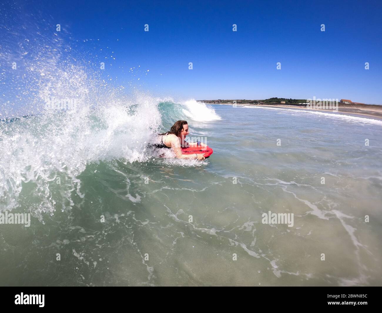Girl surf boarding hi-res stock photography and images - Alamy