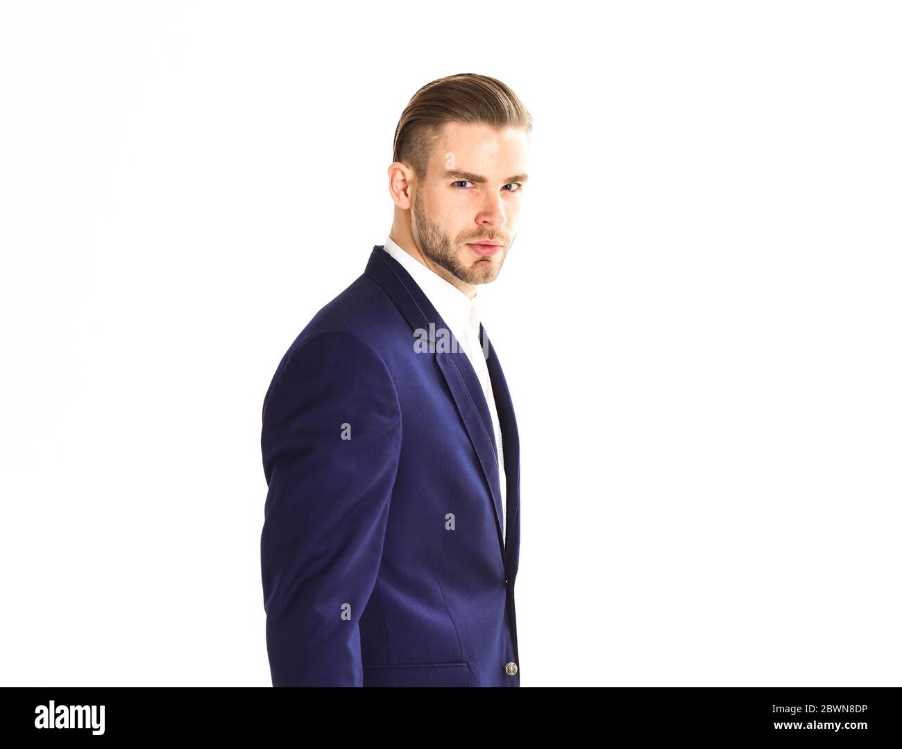 Confident elegant handsome young business man standing in front of ...