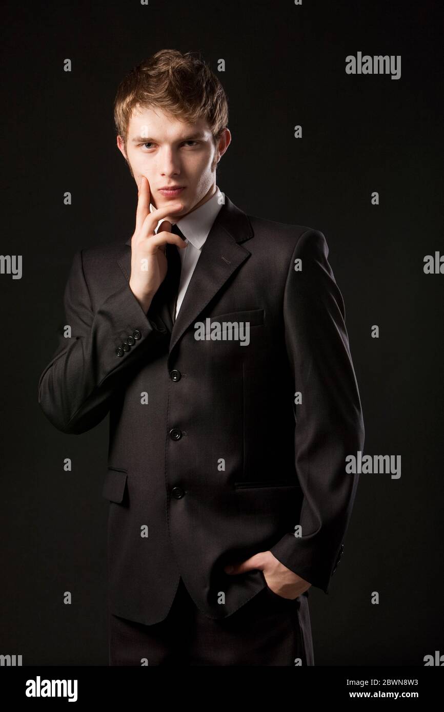 Very satisfied man in a tuxedo Stock Photo - Alamy