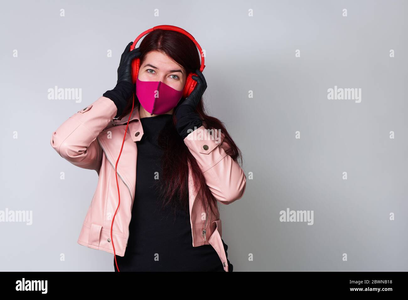Woman wearing a protective mask to prevent the spread of Coronavirus ...