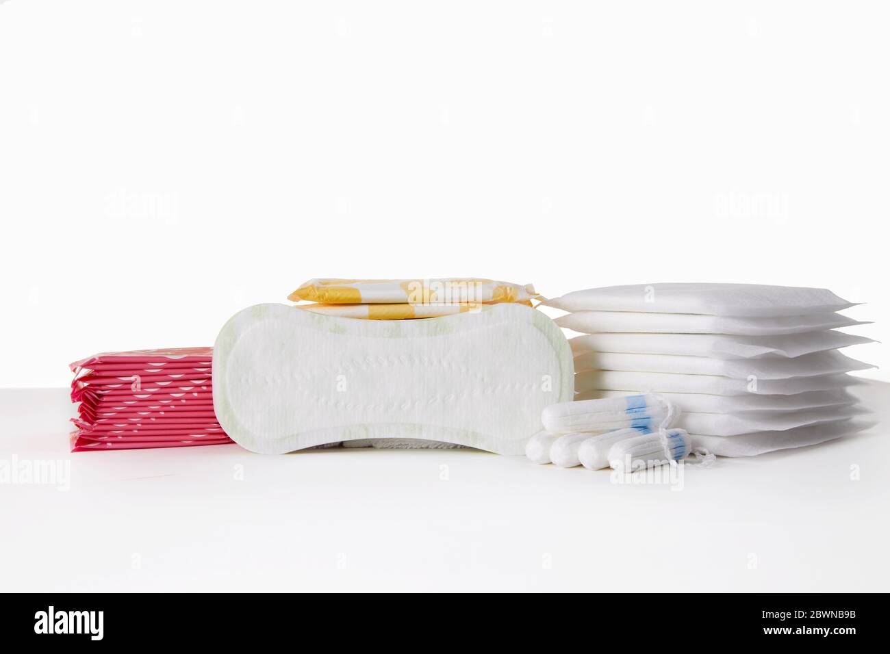 various menstrual sanitary cotton pads and tampons on white background ...