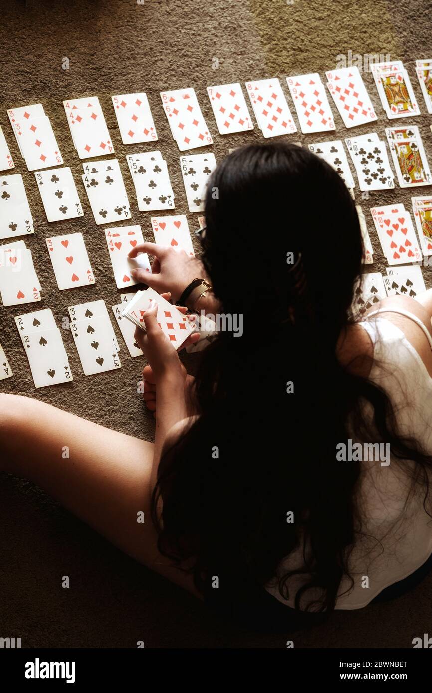 Girl playing solitaire hi-res stock photography and images - Alamy