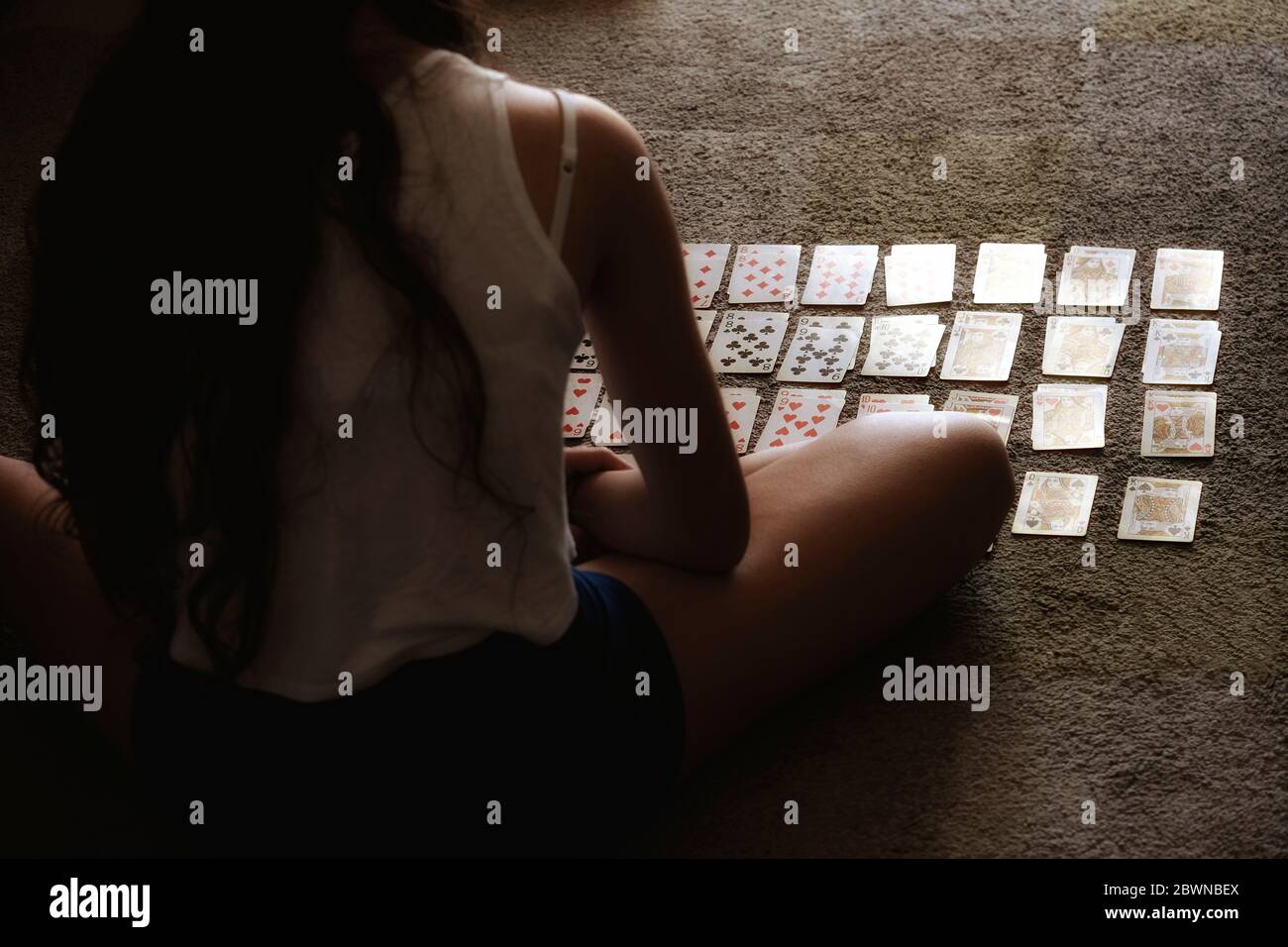 Girl playing solitaire hi-res stock photography and images - Alamy