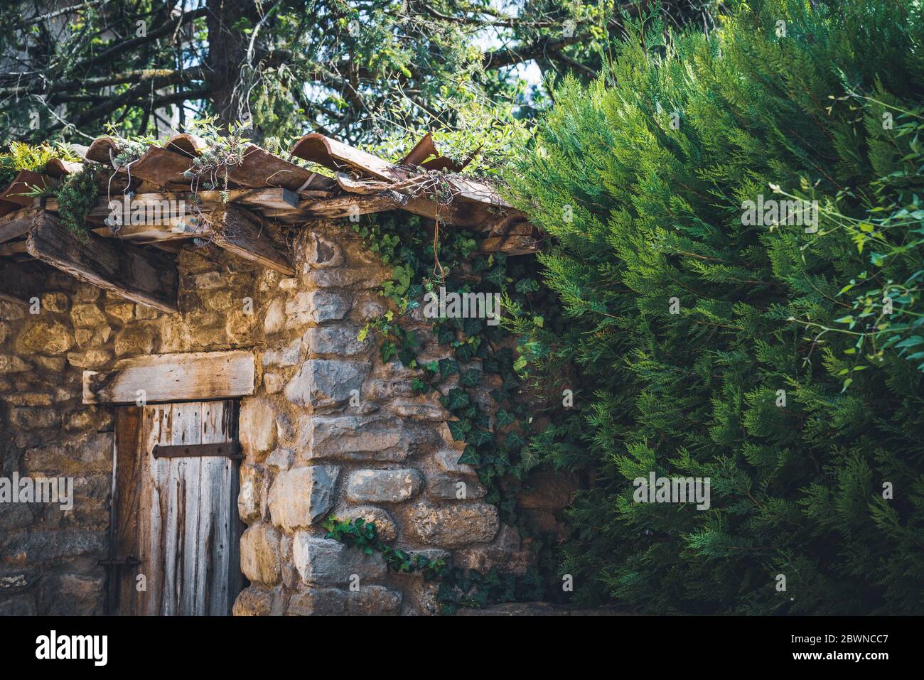 Corner of an old traditional mediterranean hut made of natural stones ...