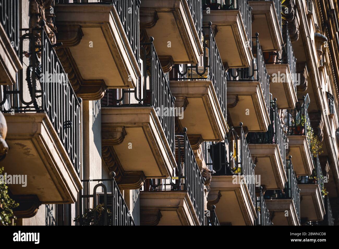 Low angle view of rows of neoclassical balconies on the facade of a ...
